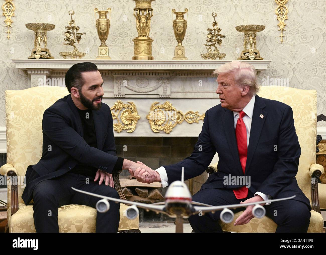 President Donald Trump, right, shakes the hand of El Salvador's ...