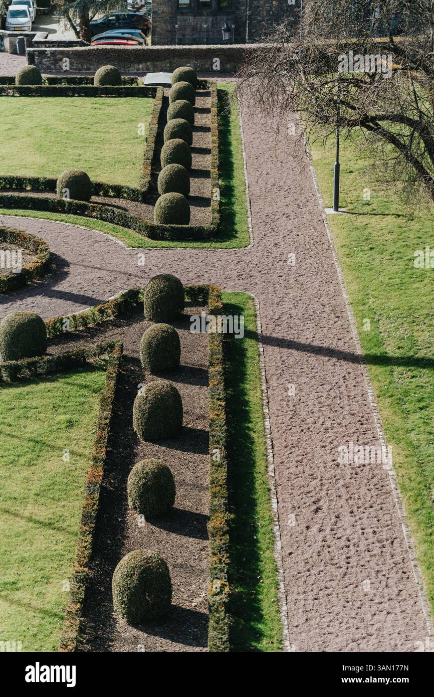 Aerial view of a well-maintained garden with symmetrical hedges and ...