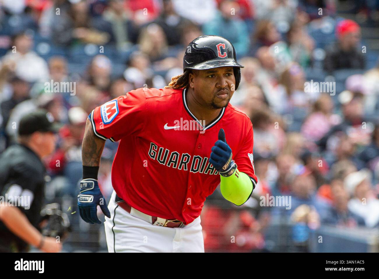 Cleveland Guardians' Jose Ramirez runs to first base against the Kansas ...
