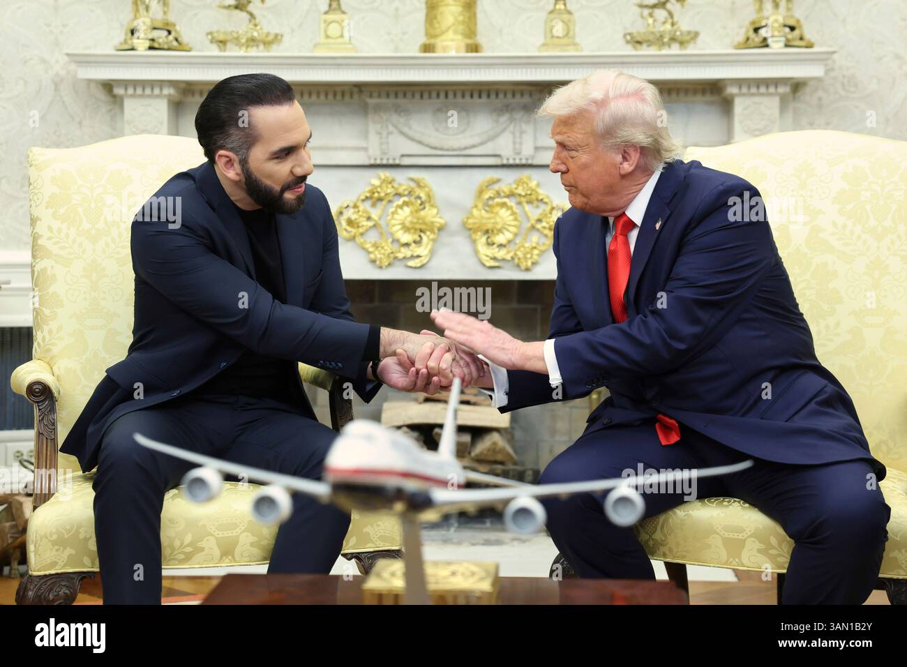 President Donald Trump, right, shakes the hand of El Salvador's ...