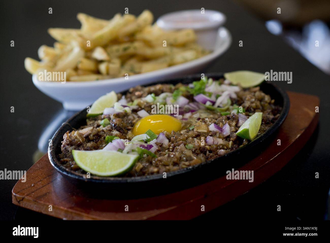 May 5, 2014 - Sacramento, CA, USA - Sizzling sisig, a chopped ...