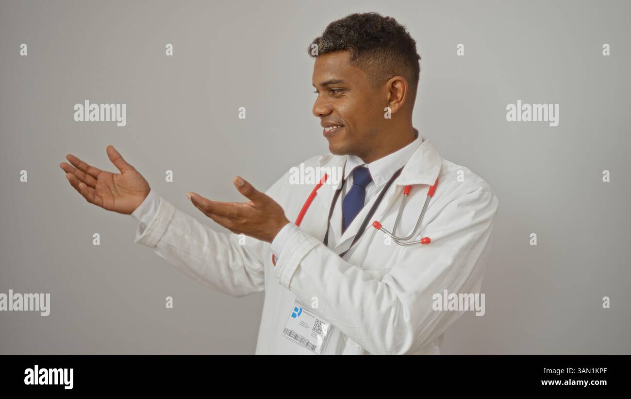 Young hispanic doctor presenting with hands over white background ...