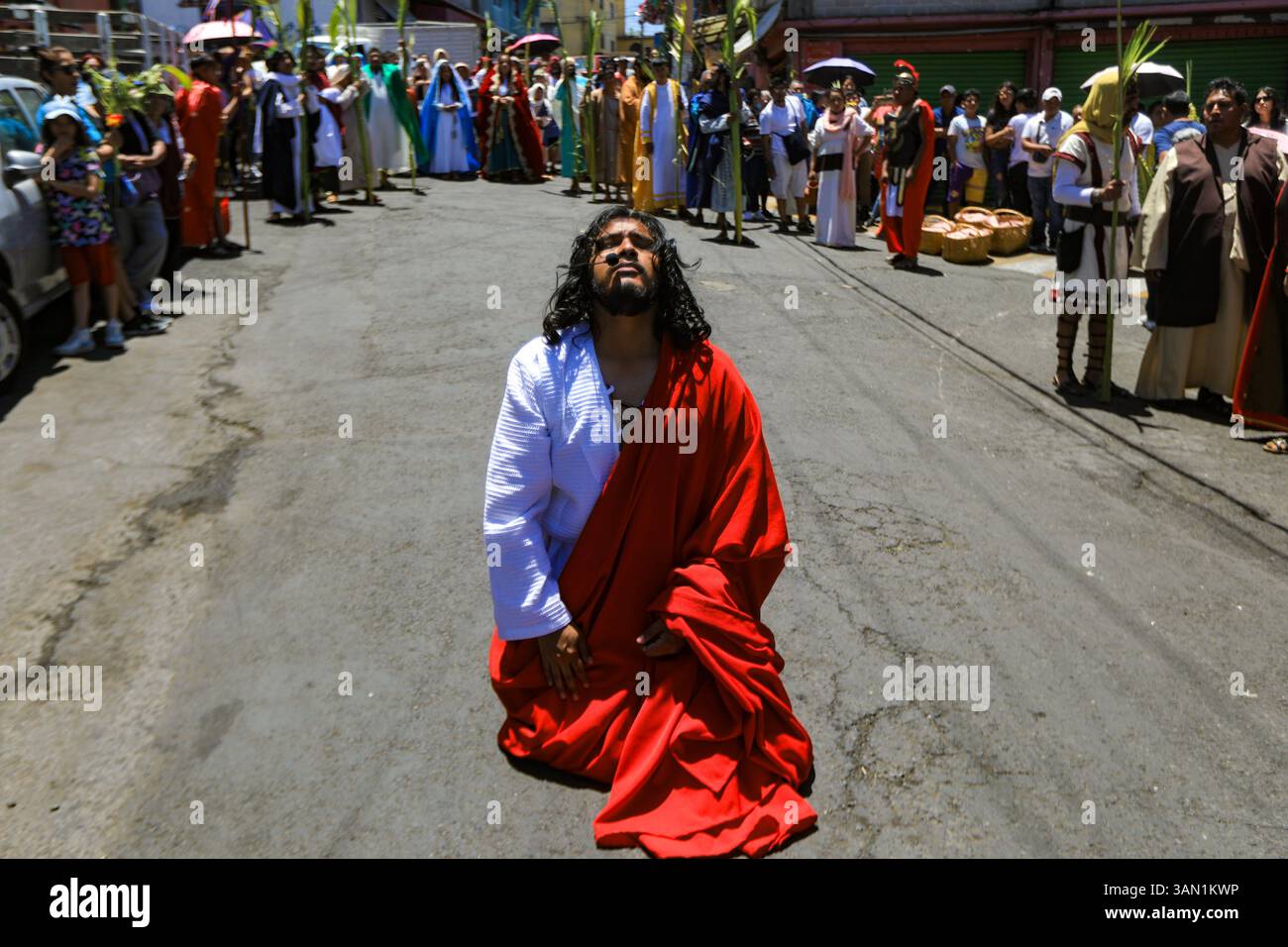 An actor representing Jesus taking part during the reenactment of the ...
