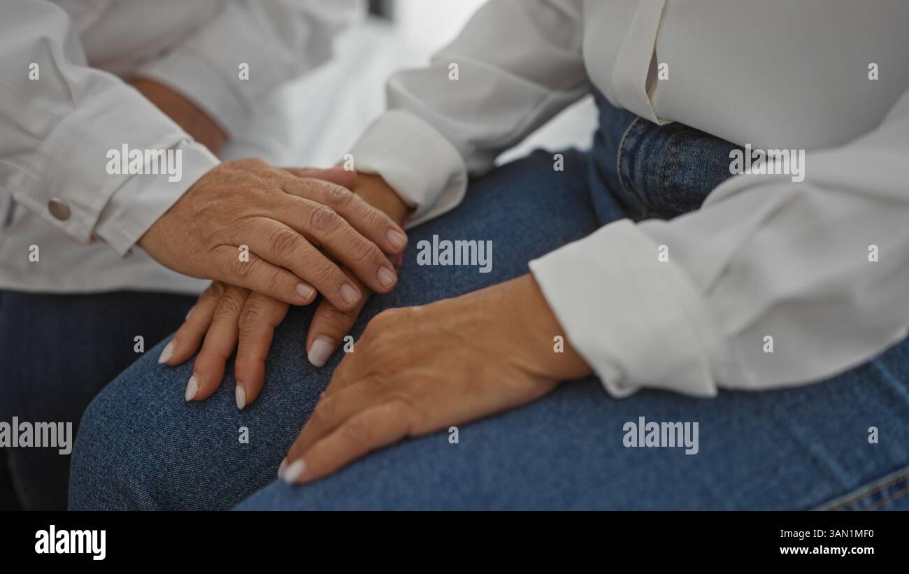Hands of two women, doctor and patient, in a supportive gesture in a ...