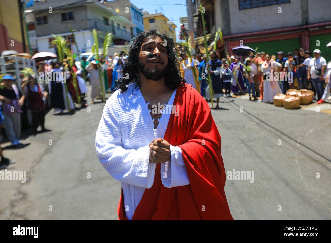 An actor representing Jesus taking part during the reenactment of the ...