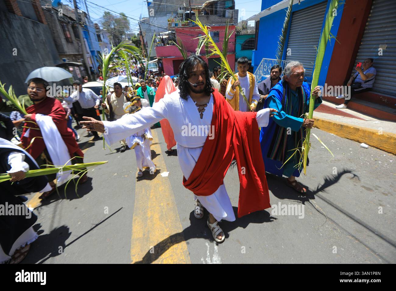An actor representing Jesus taking part during the reenactment of the ...