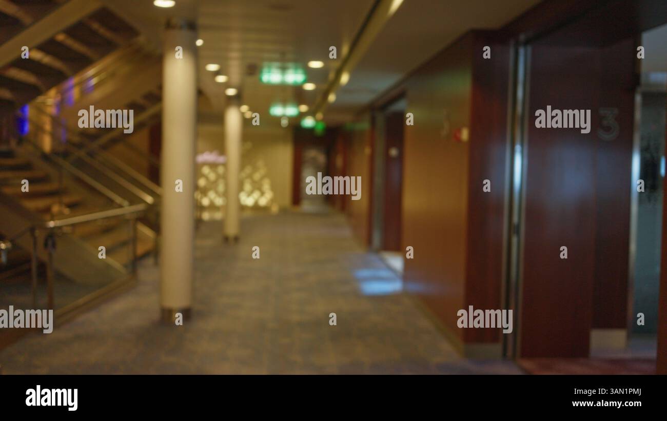 Blurred hallway on luxury cruise ship features elegant interior design ...