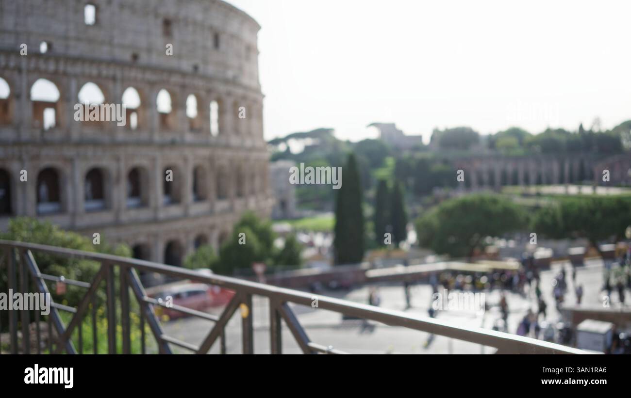Colosseum in rome with blurred people in foreground creating a bokeh ...