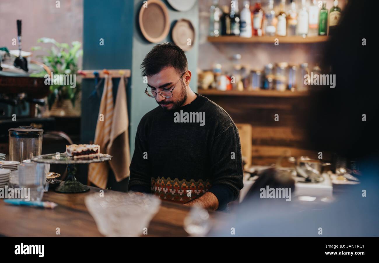 Barista working in a cozy cafe with warm interior design and decor ...