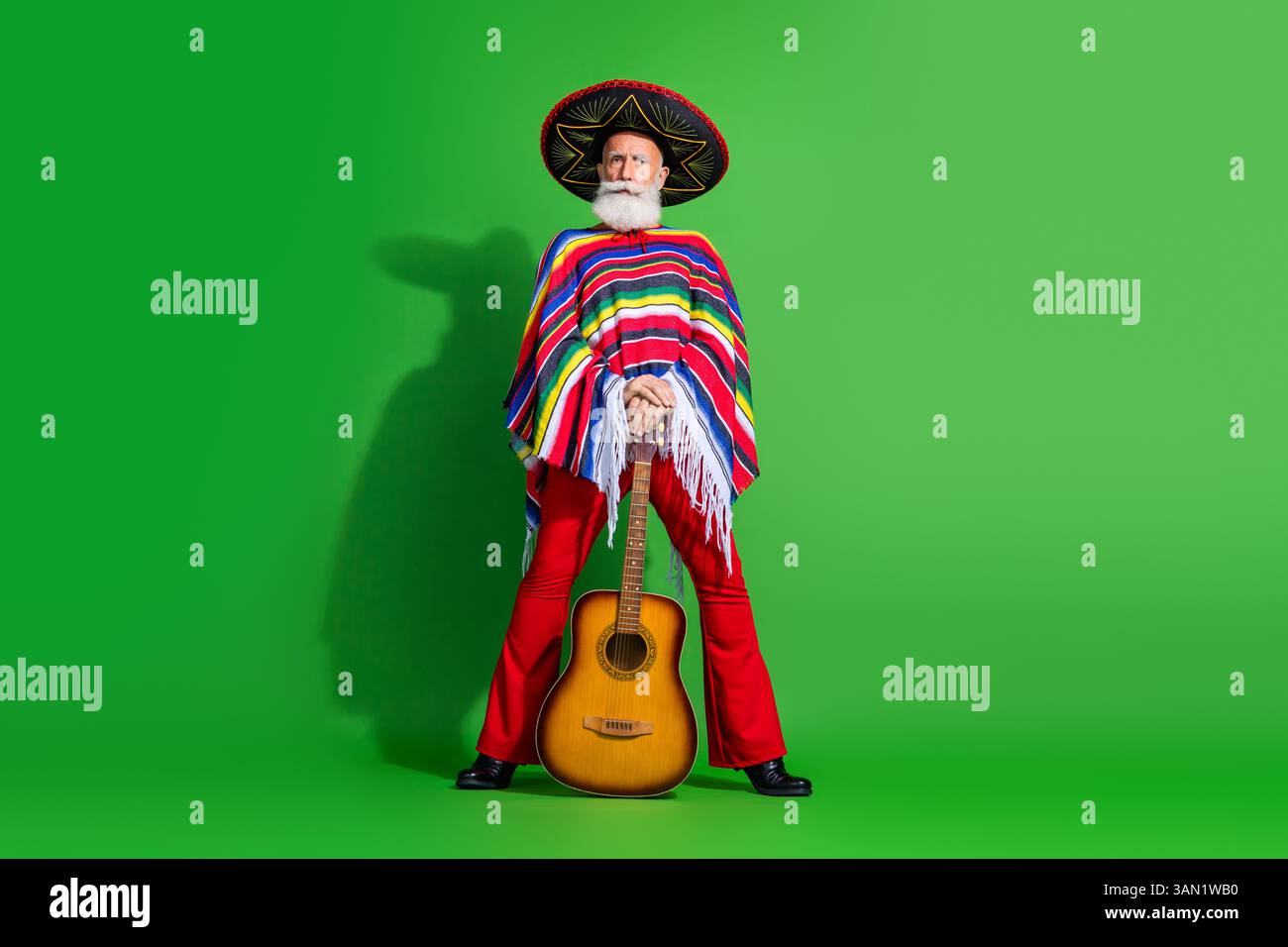 Charismatic man in colorful traditional Mexican attire with sombrero ...