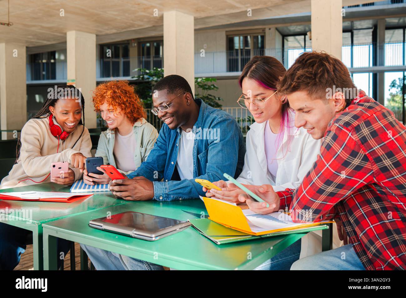 Students collaborating through digital devices hi-res stock photography ...
