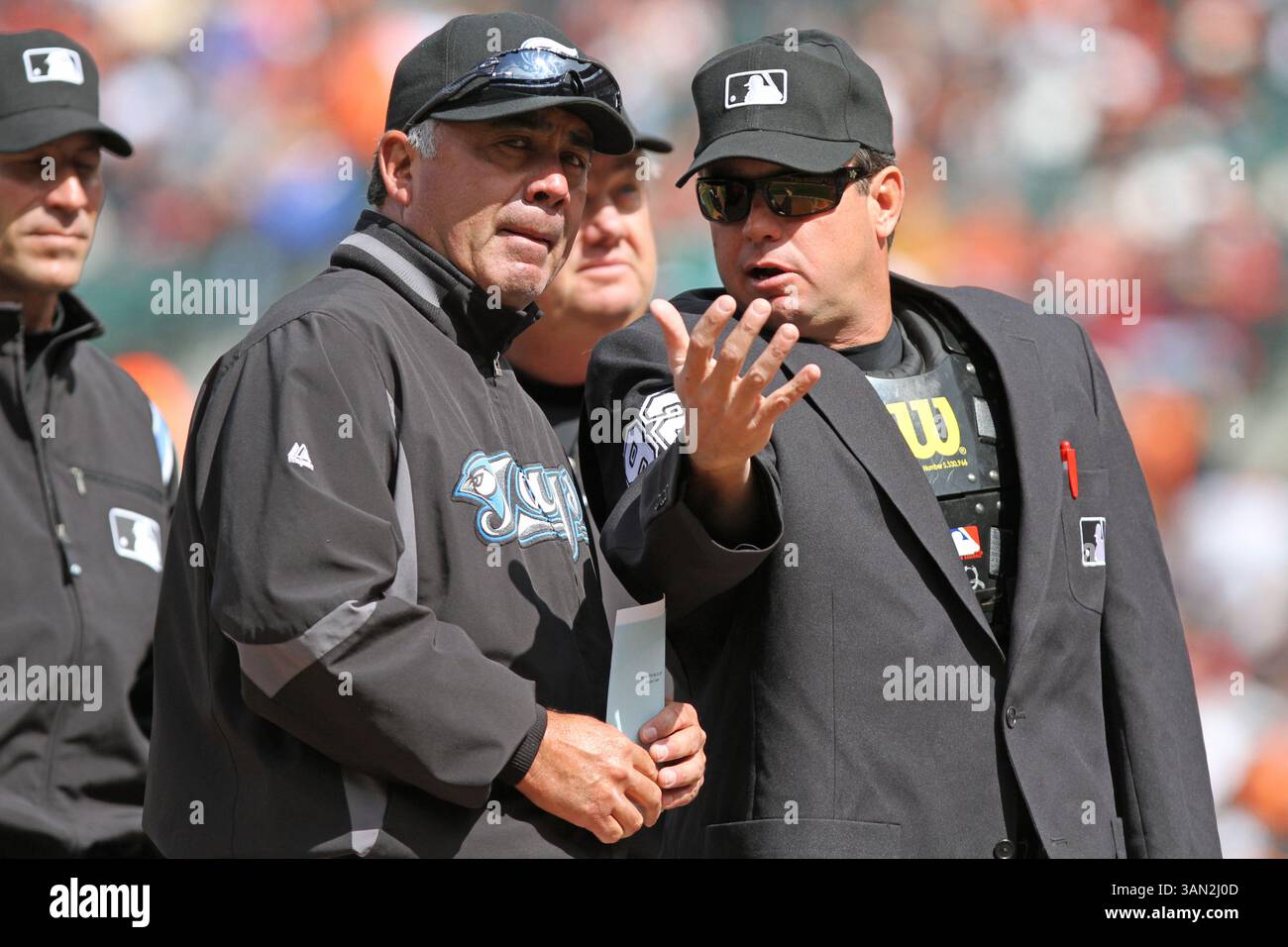 April 9, 2010: Homeplate umpire Rob Drake explains the field ground ...