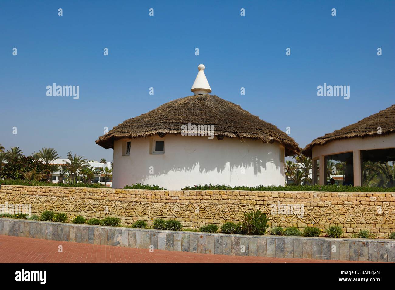 Traditional round hut with thatched roof near agadir beach in agadir ...