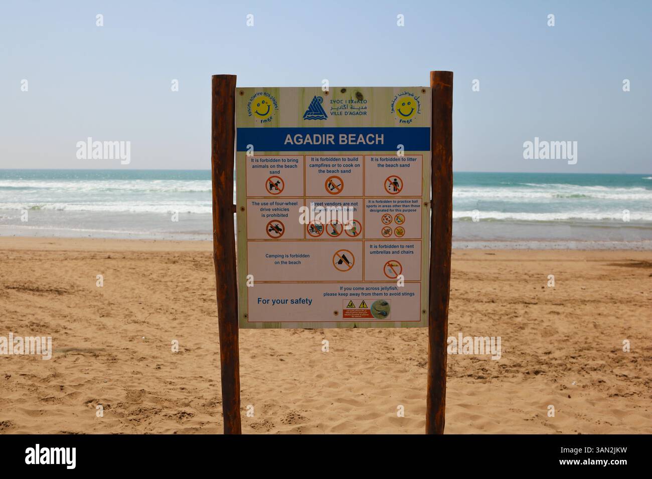 Agadir beach safety sign with ocean in background, moroccan coast ...
