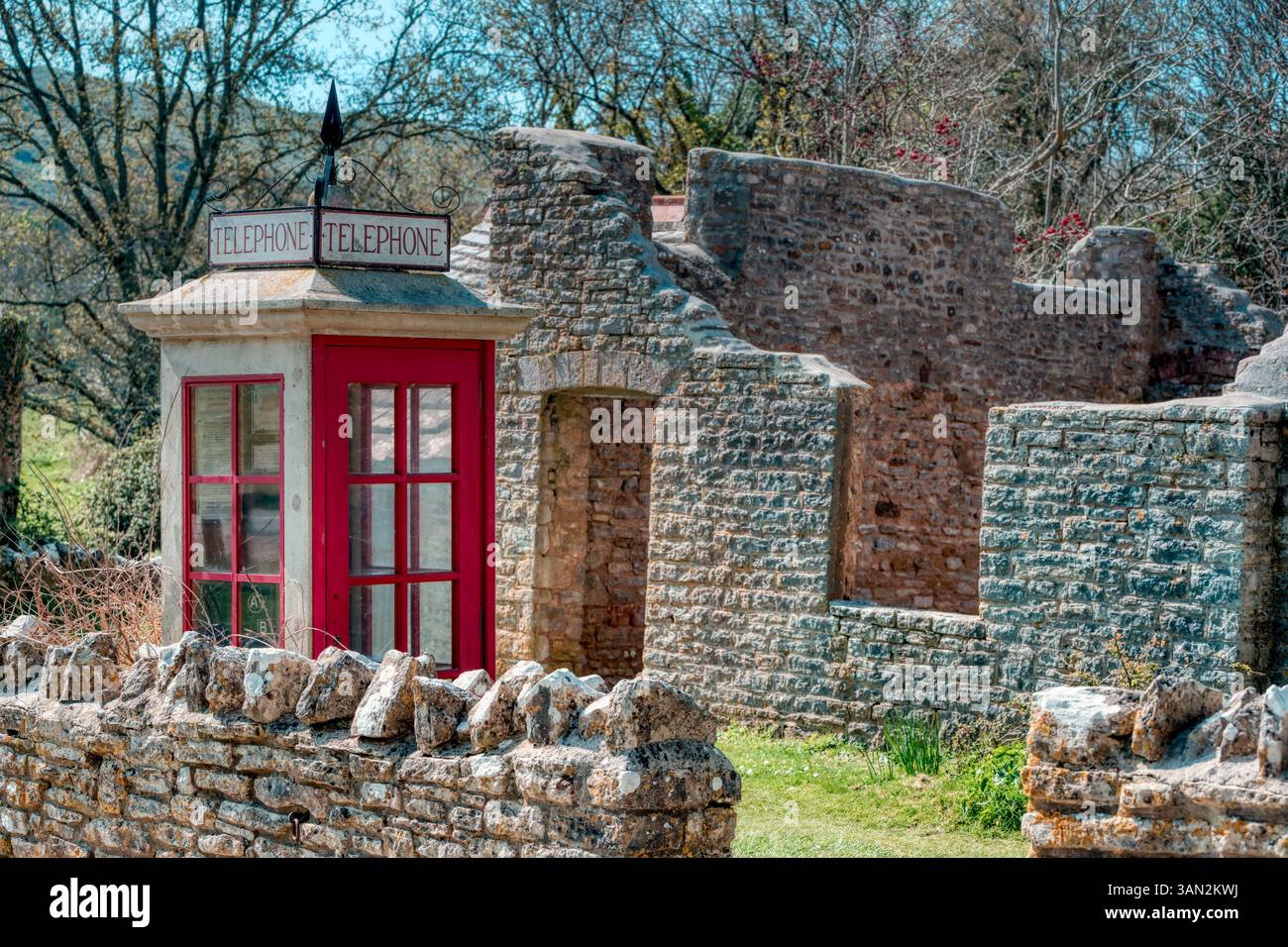 An old telephone box outside a row of abandoned cottages at Tyneham ...