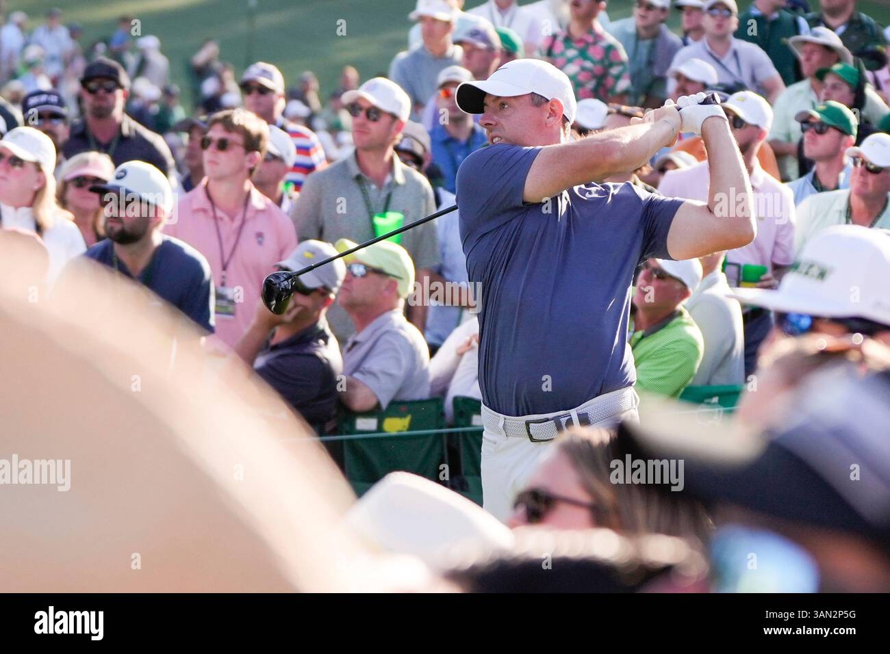 Rory McIlroy, of Northern Ireland, watches his tee shot on the 17th ...