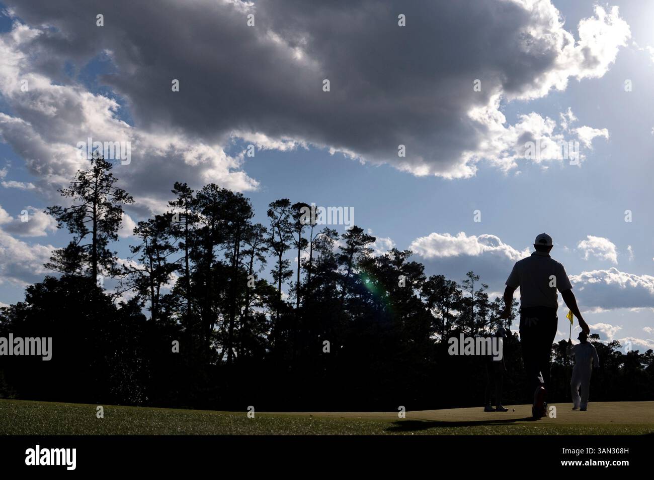 Rory McIlroy, of Northern Ireland, walks on the 14th green during the ...