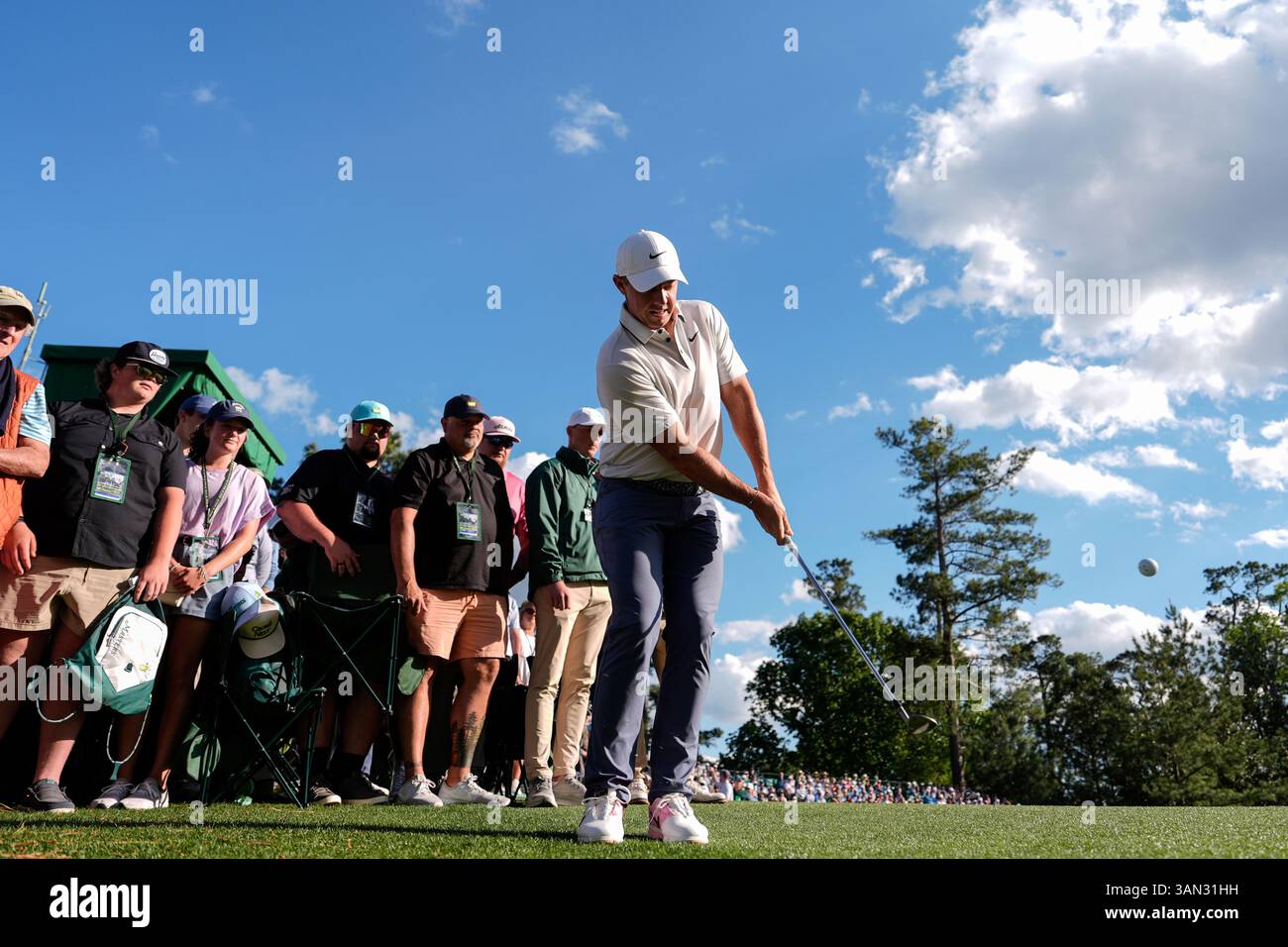 Rory McIlroy, of Northern Ireland, chips to the green on the 14th hole ...