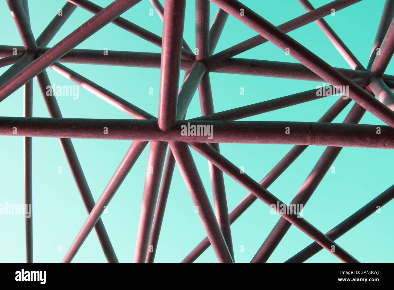 Welded iron figure sculpture made from pipes in front of colorful ...