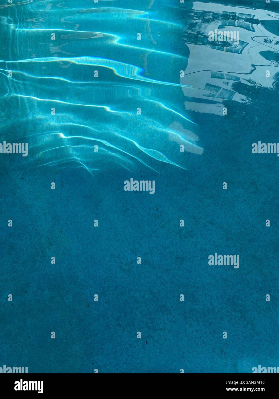 Decorative pool with old stone floor and sun flares Stock Photo - Alamy