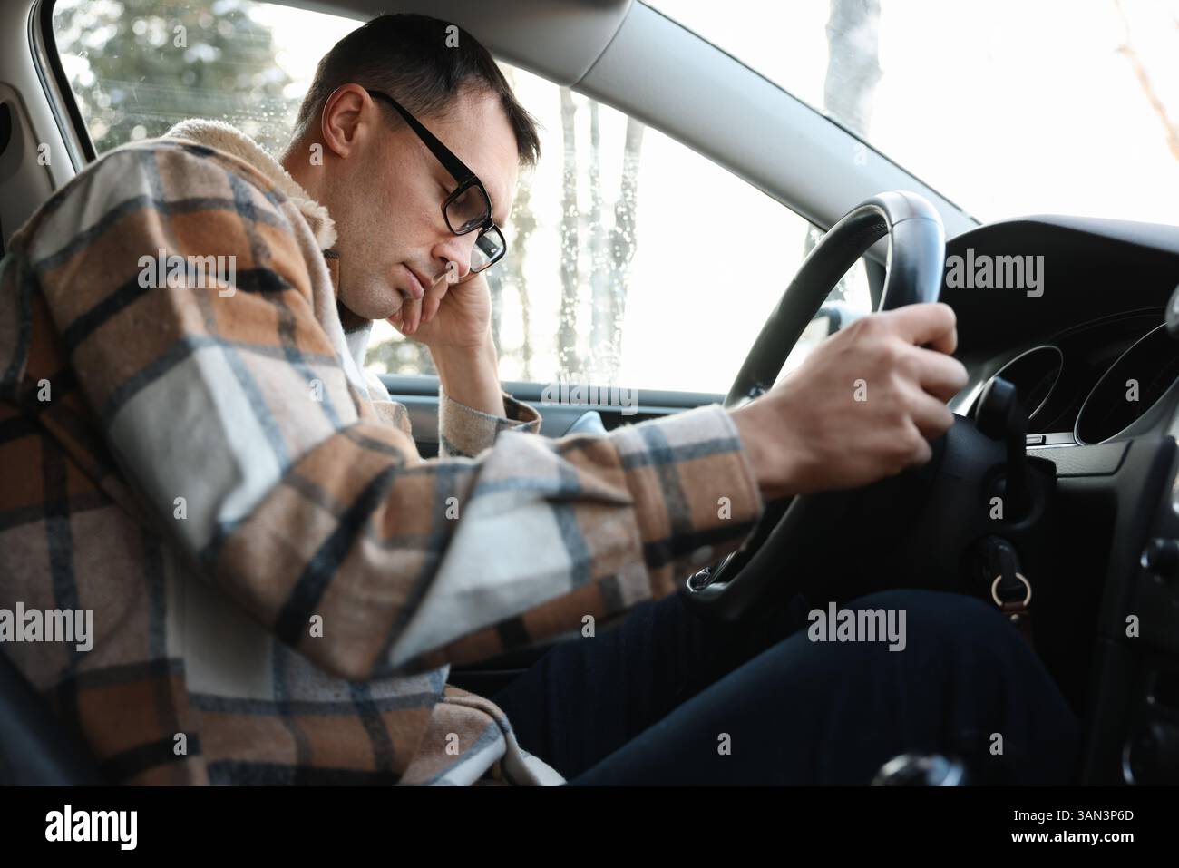 Tired driver sleeping in his modern car Stock Photo - Alamy