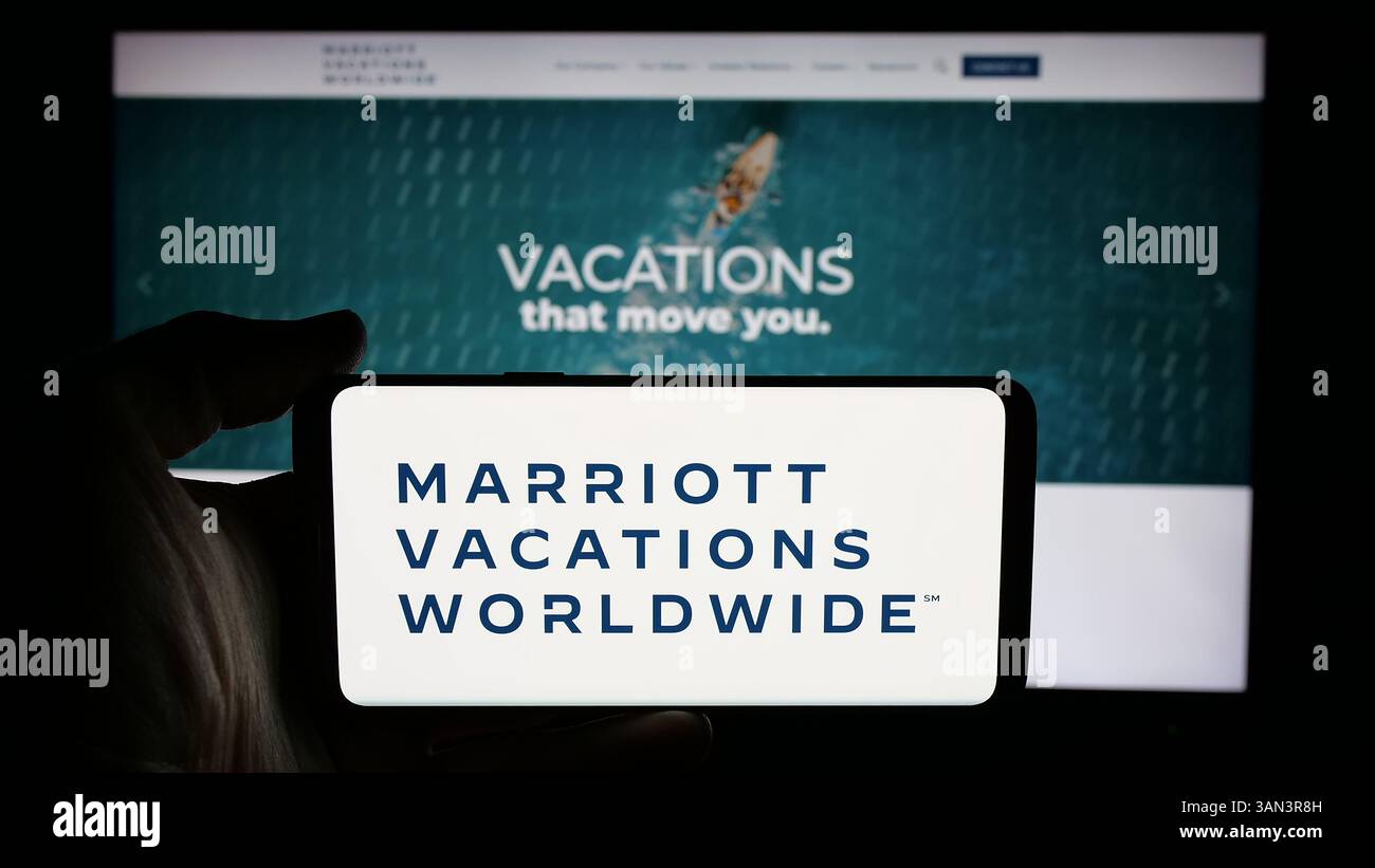 Stuttgart, Germany - 12-02-2024: Person holding cellphone with logo of ...