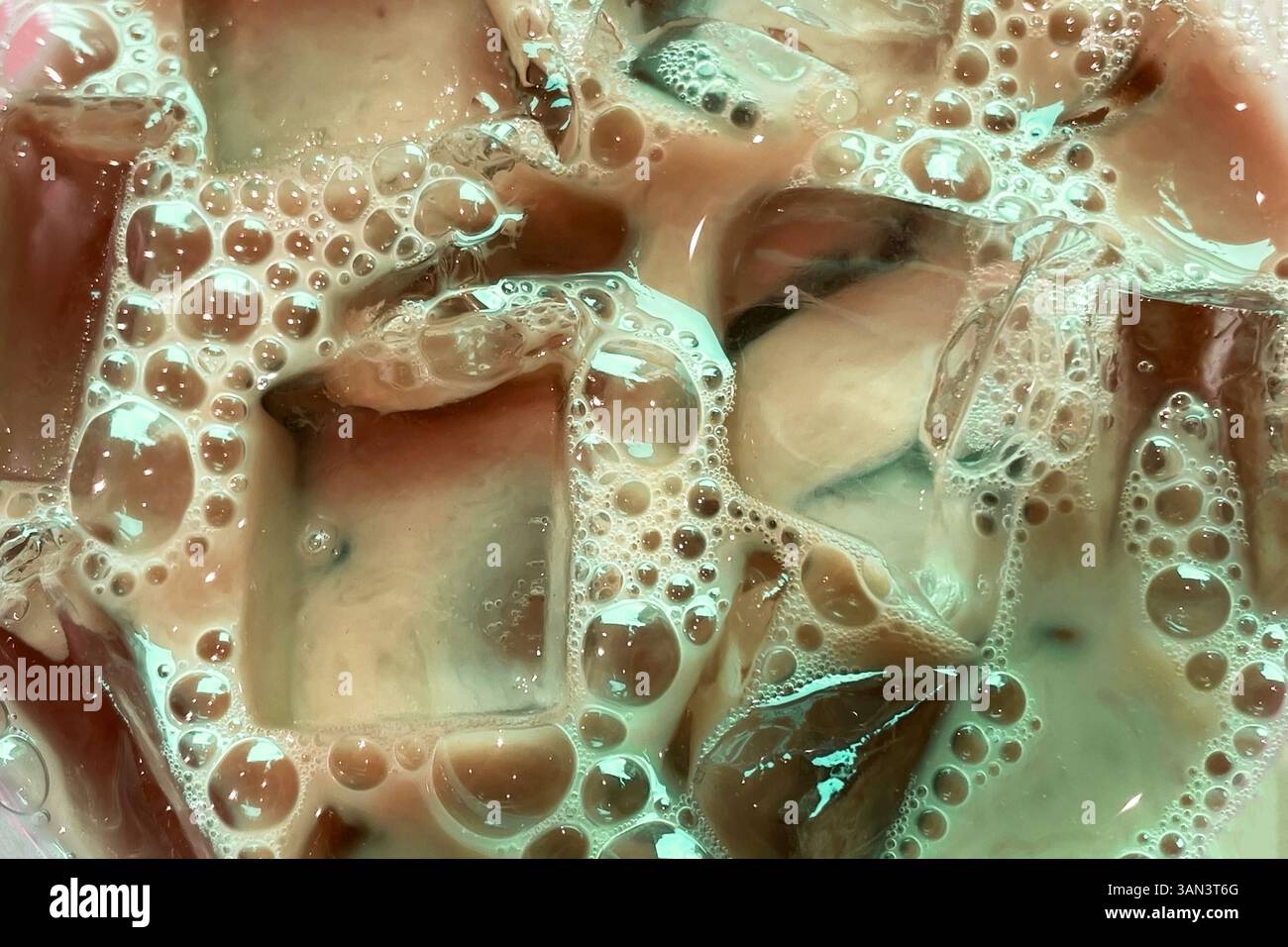 Bright chilled soda with rising bubbles and crystal clear ice Stock ...