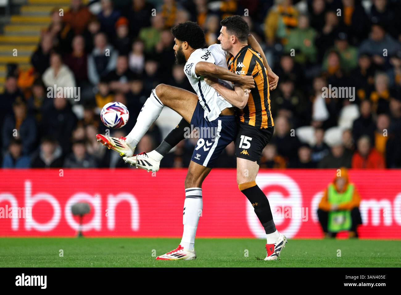 Coventry City's Ellis Simms (left) and Hull City's John Egan battle for ...