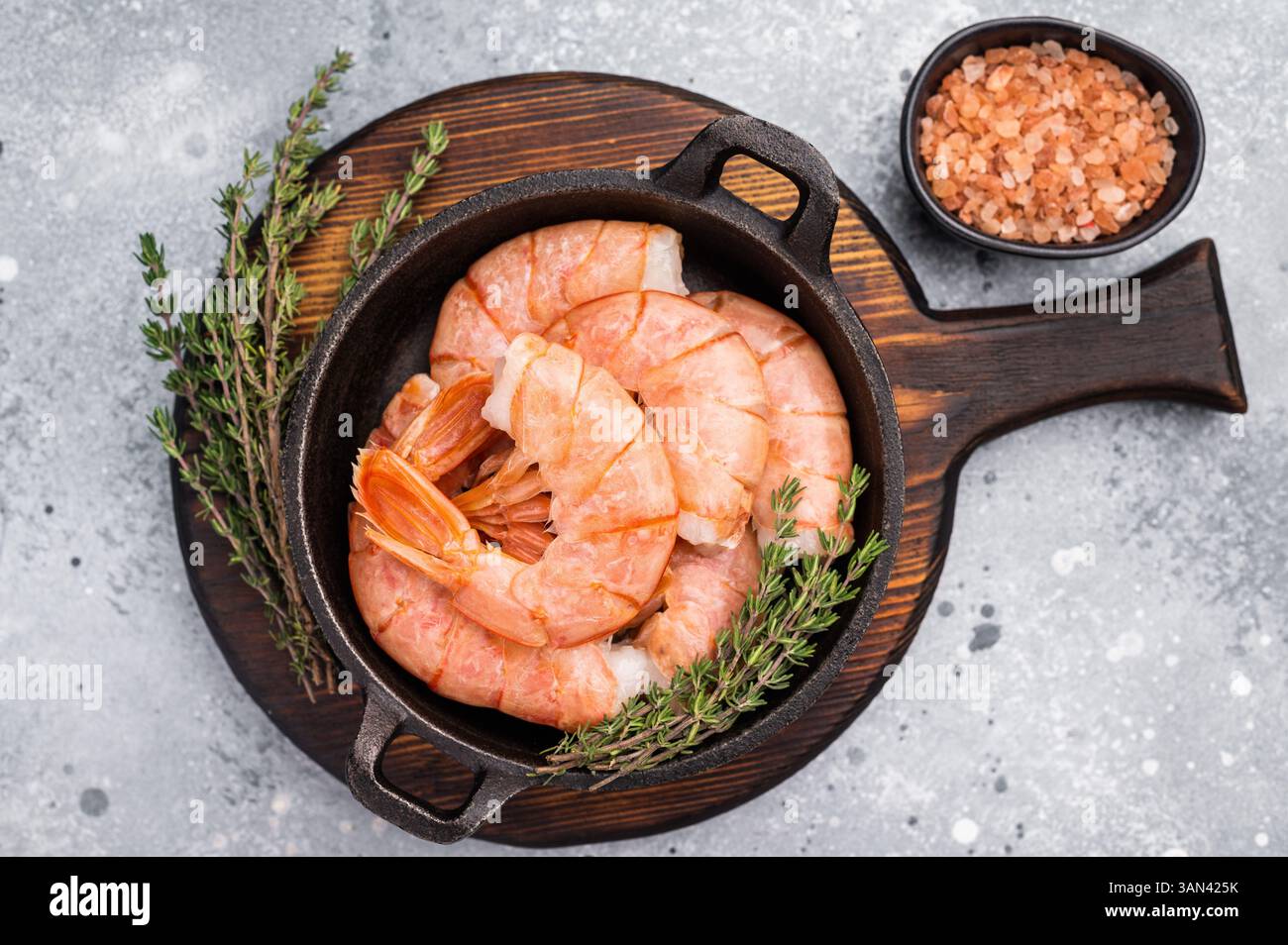 Raw Headless Red Argentine shrimps, Prawns in a skillet. grey ...