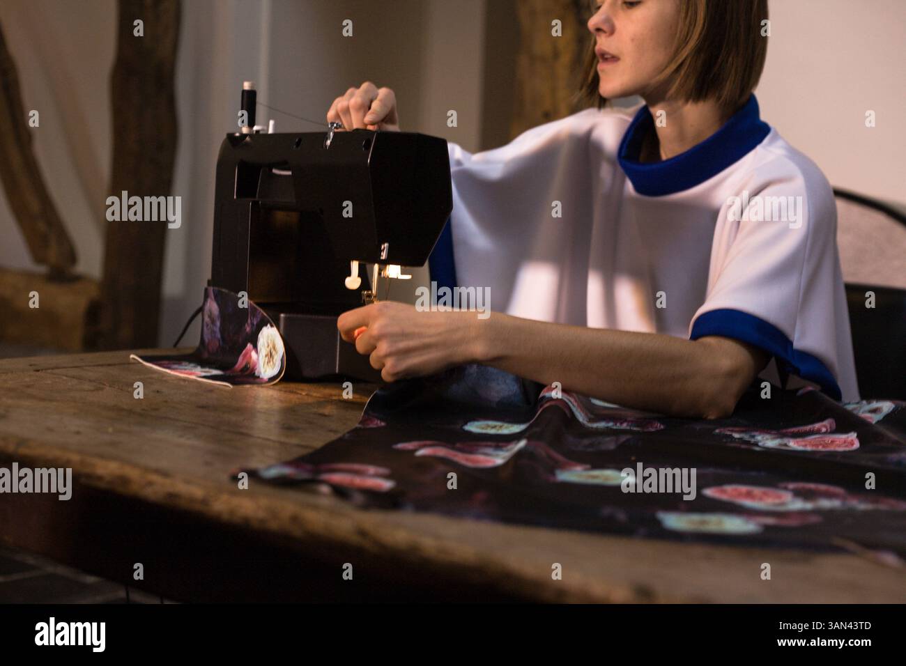 Tailor woman setting sewing machine hi-res stock photography and images ...