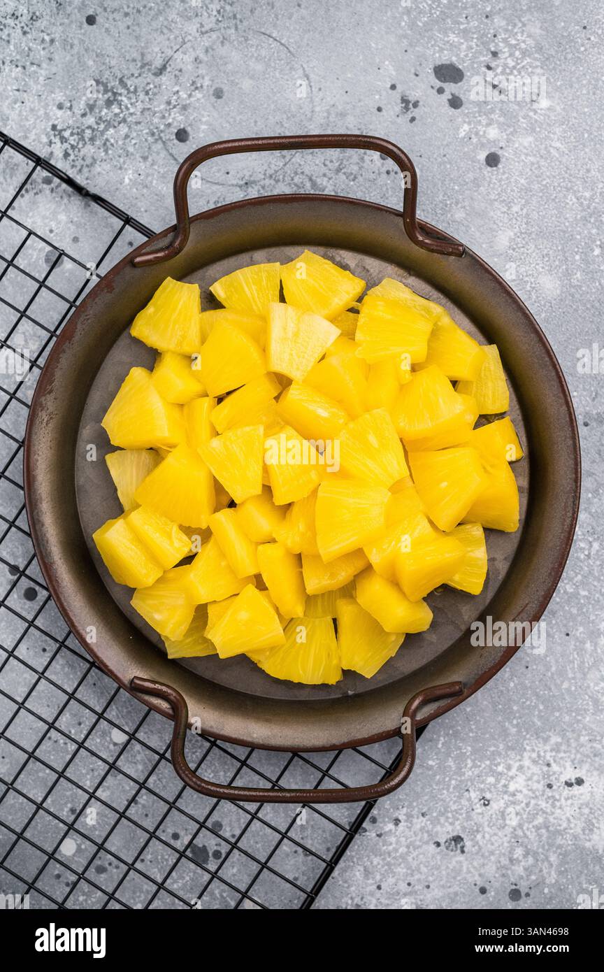 Canned Pineapple chunks slices in a bowl. grey background. top view ...