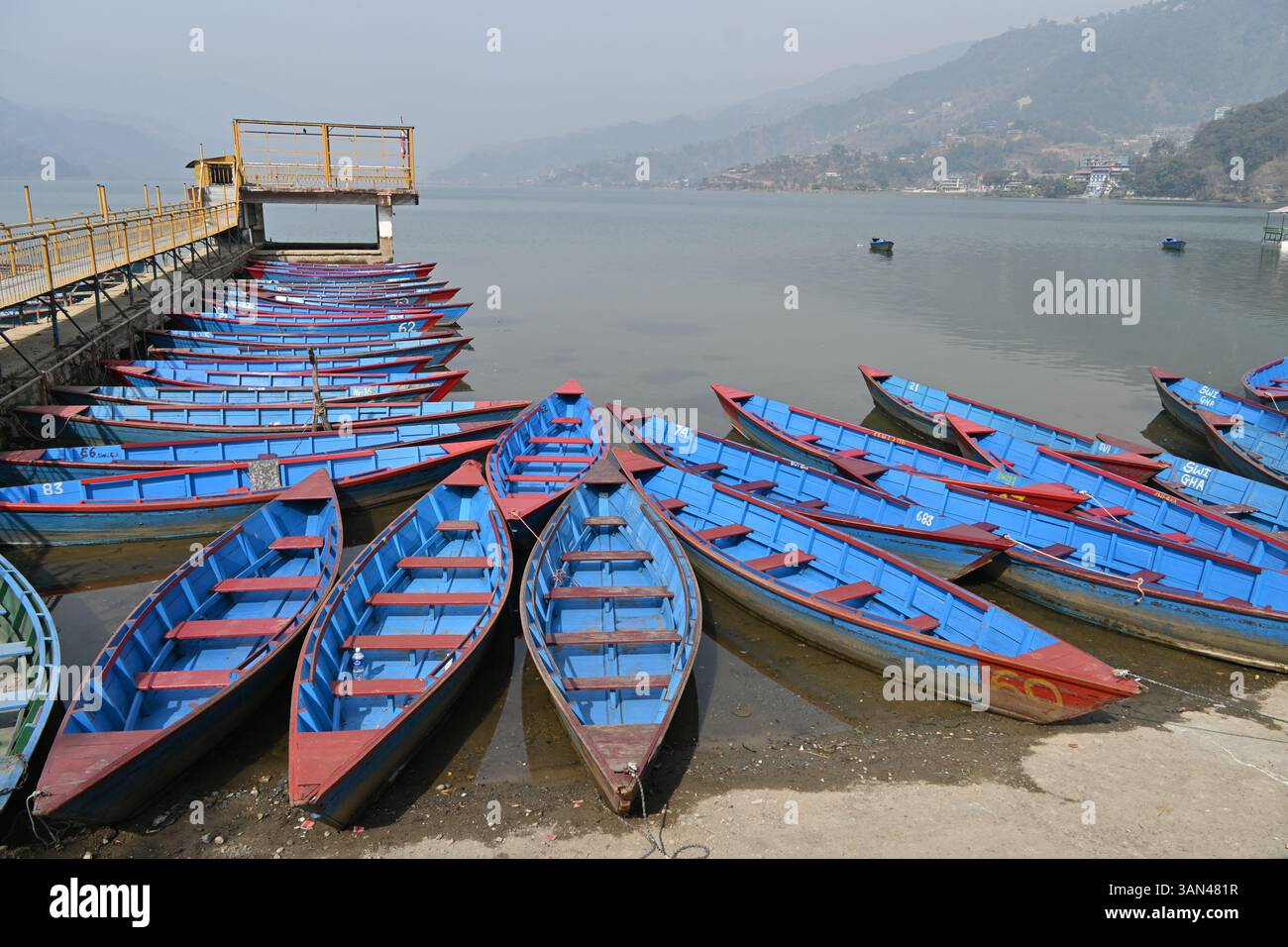 Colorful boats floating on lake Phewa, the second largest lake in Nepal ...
