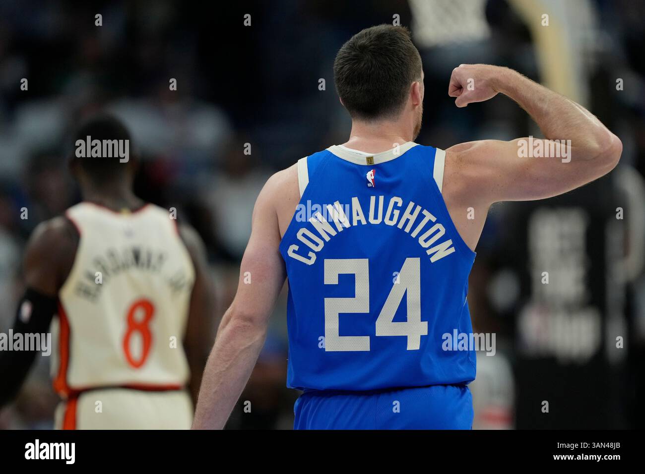 Milwaukee Bucks' Pat Connaughton flexes during the first half of an NBA ...