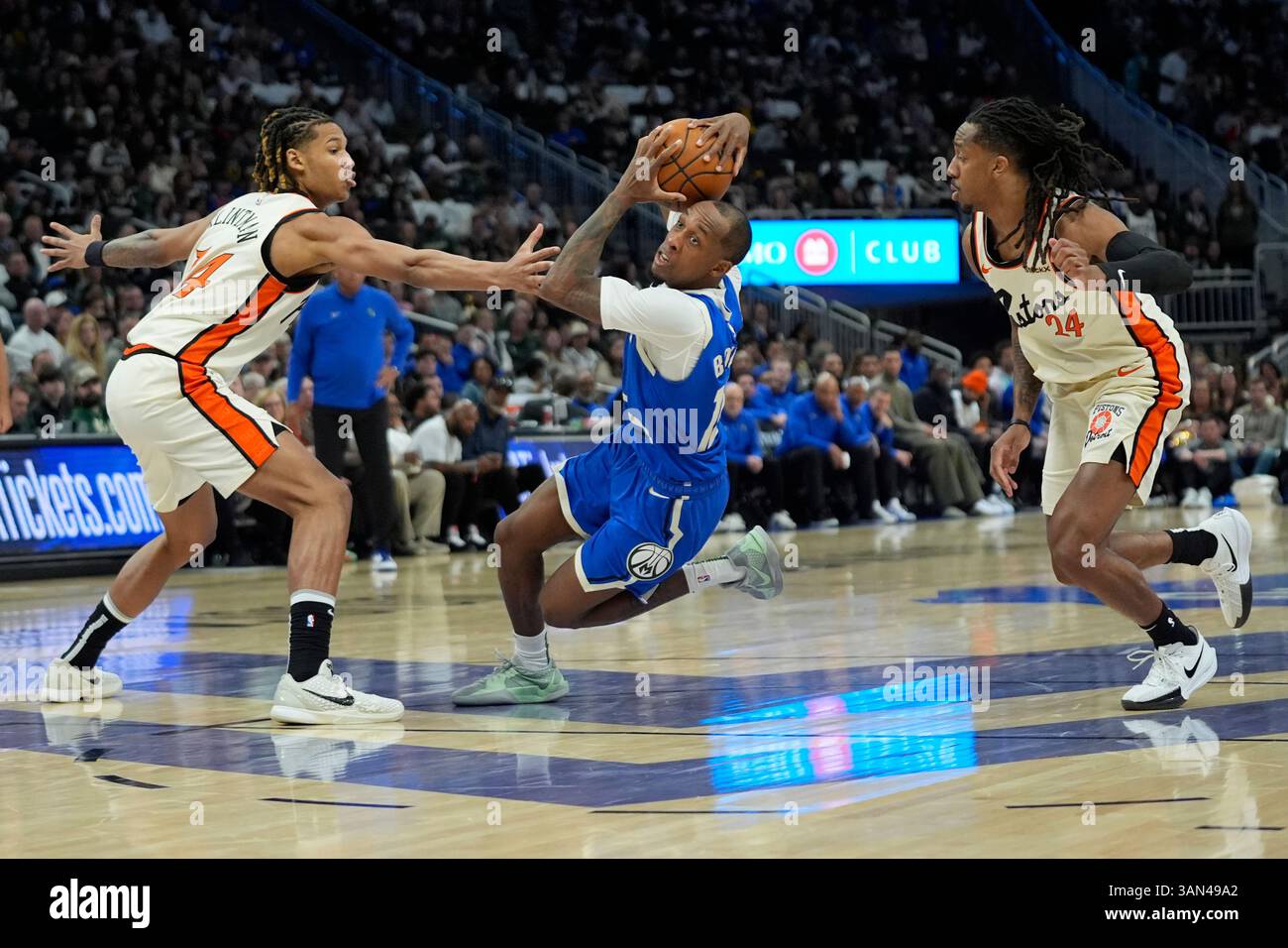 Milwaukee Bucks' Jamaree Bouyea falls to the floor between Detroit ...