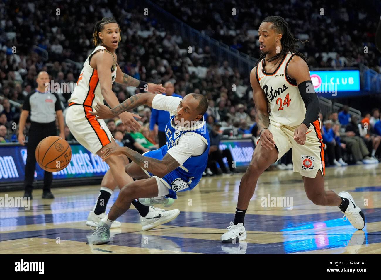 Milwaukee Bucks' Jamaree Bouyea falls to the floor between Detroit ...