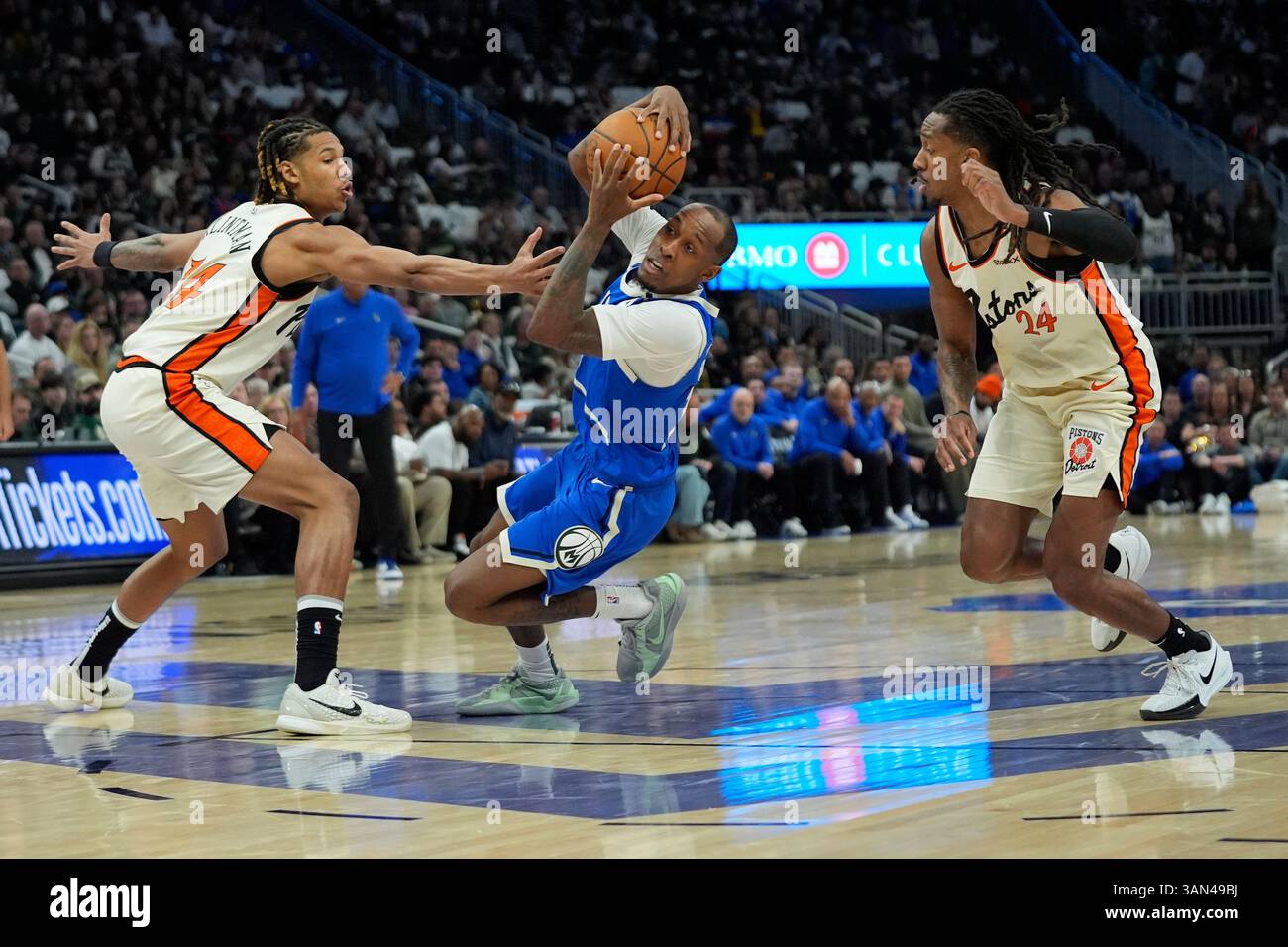 Milwaukee Bucks' Jamaree Bouyea falls to the floor between Detroit ...