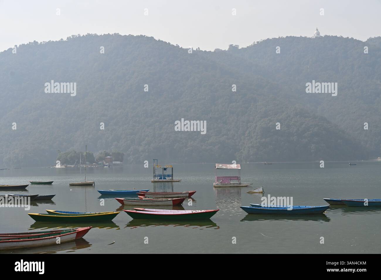 Colorful boats floating on lake Phewa, the second largest lake in Nepal ...