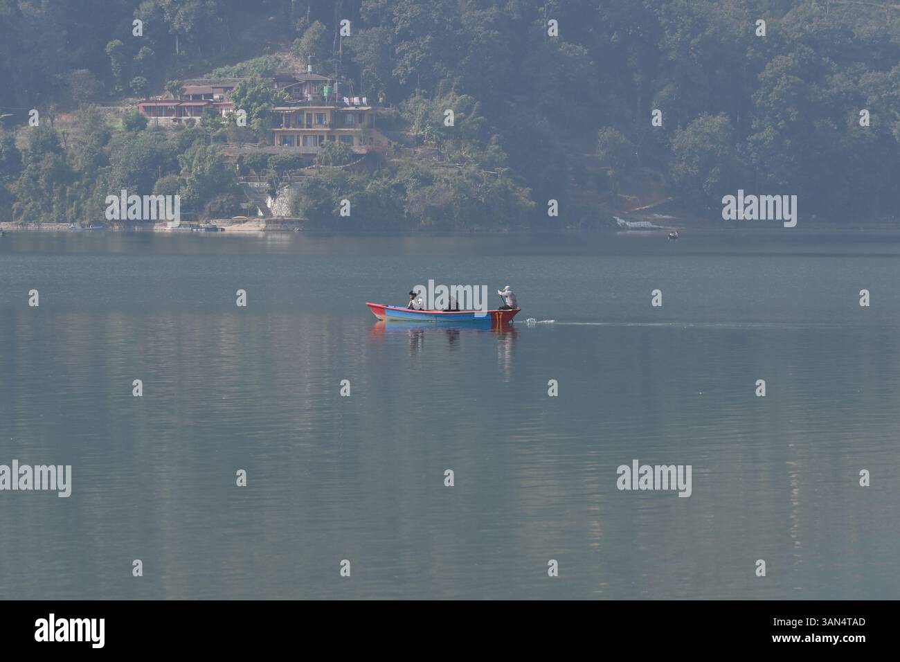Colorful boats floating on lake Phewa, the second largest lake in Nepal ...