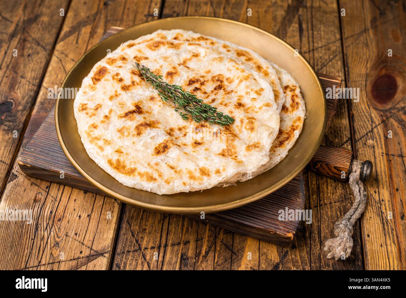 Potato Stuffed Flat Bread Aloo paratha, Traditional Indian food. wooden ...