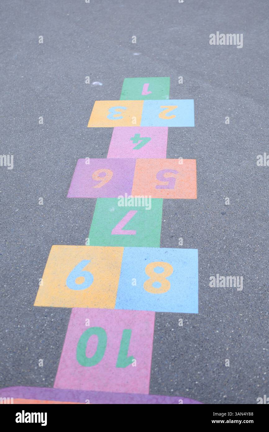 Hopscotch numbers on a tarmac playground - childrens game concept ...