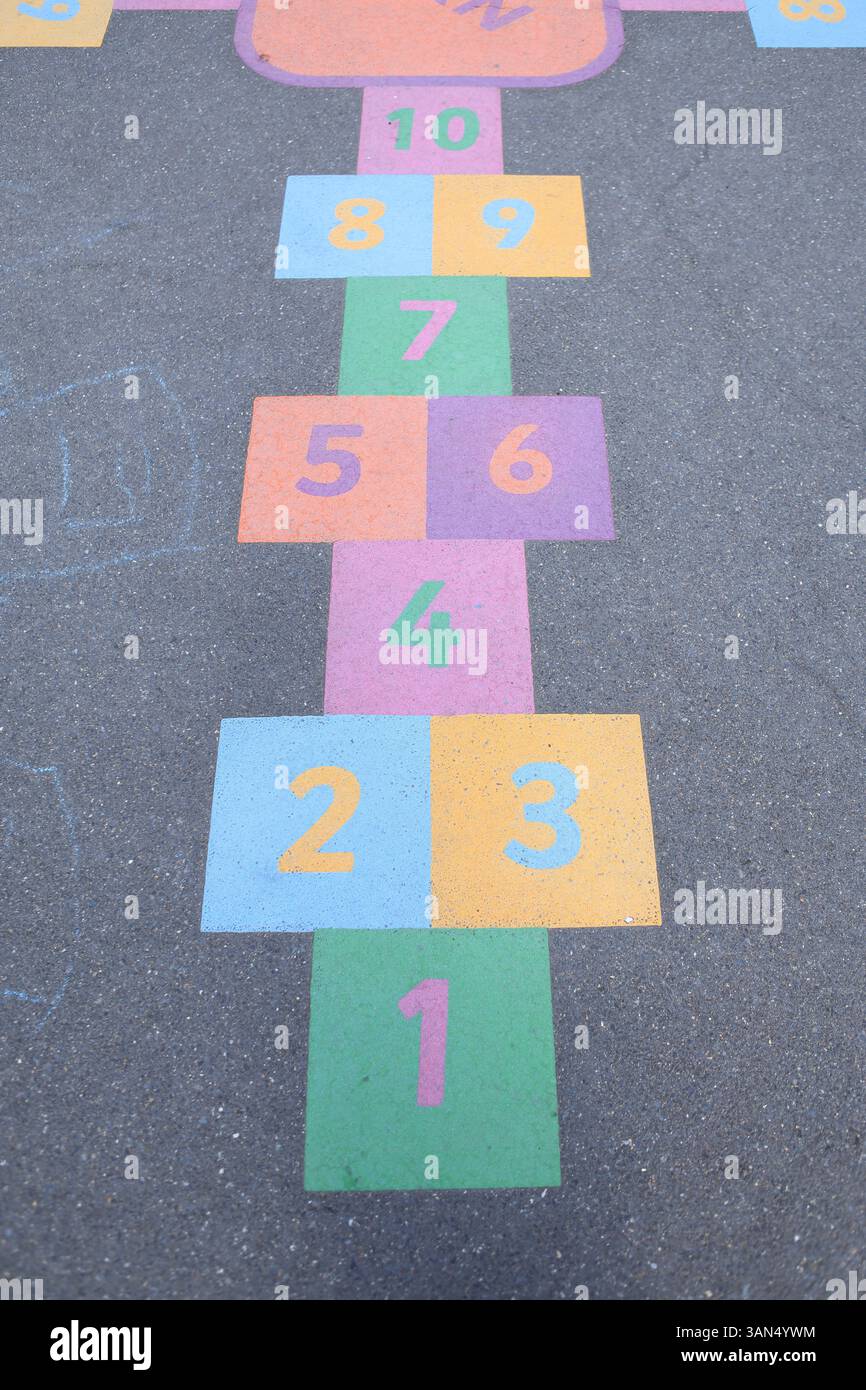 Hopscotch numbers on a tarmac playground - childrens game concept ...