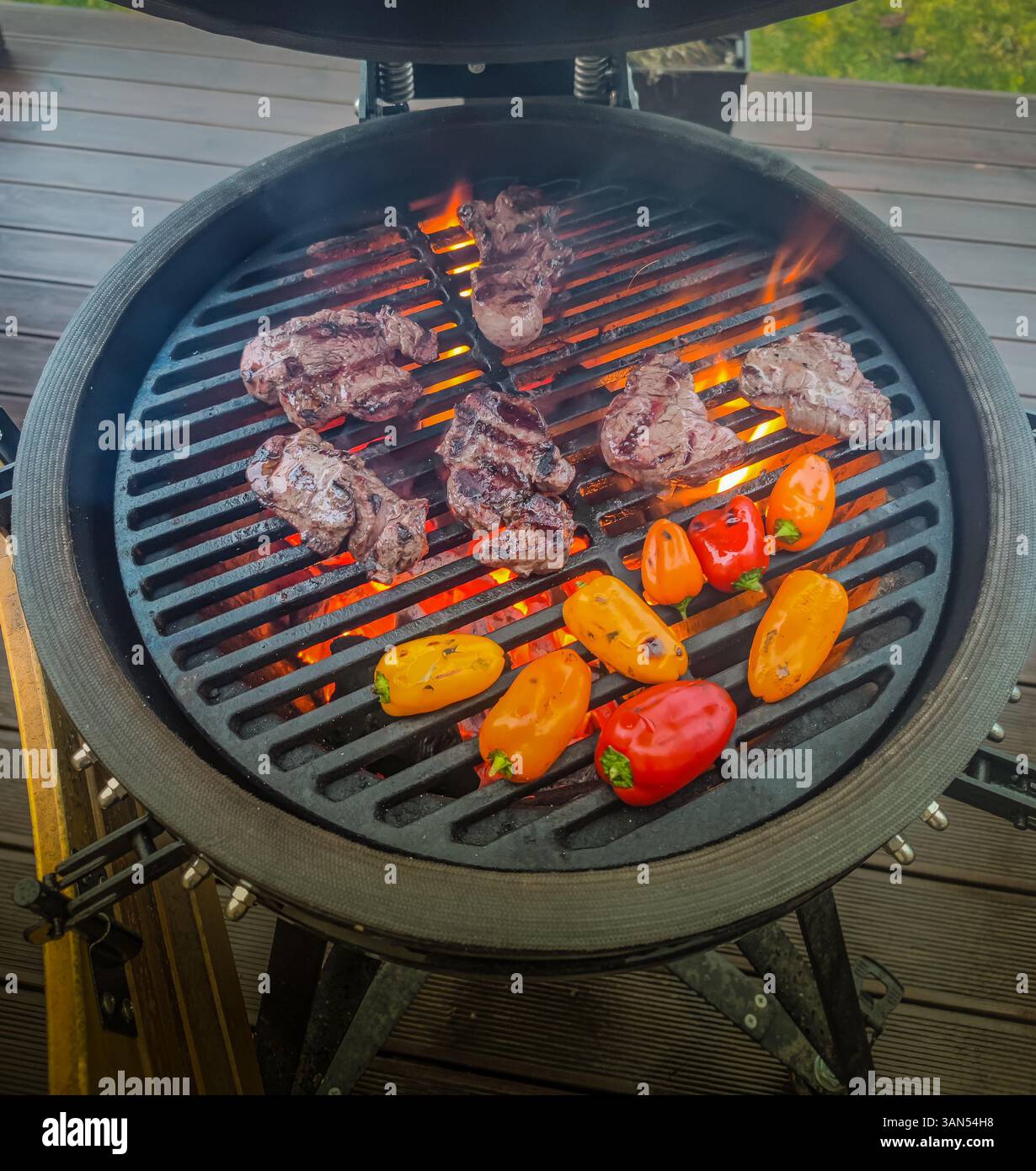 A kamado egg type barbeque grill standing on a living house terrace ...