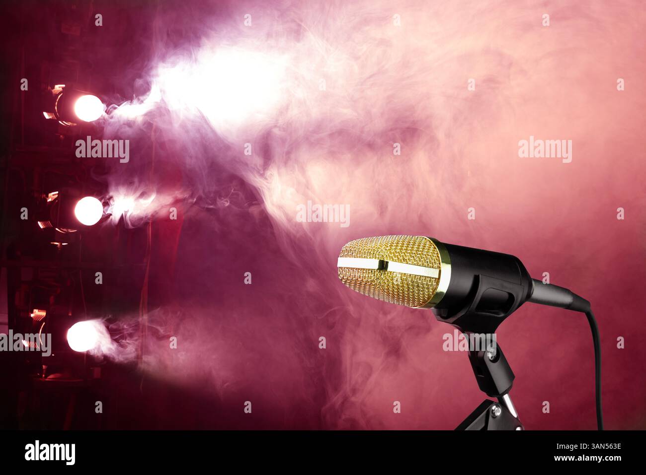 Microphone on stage in smoke under spotlights. Singer's performance ...