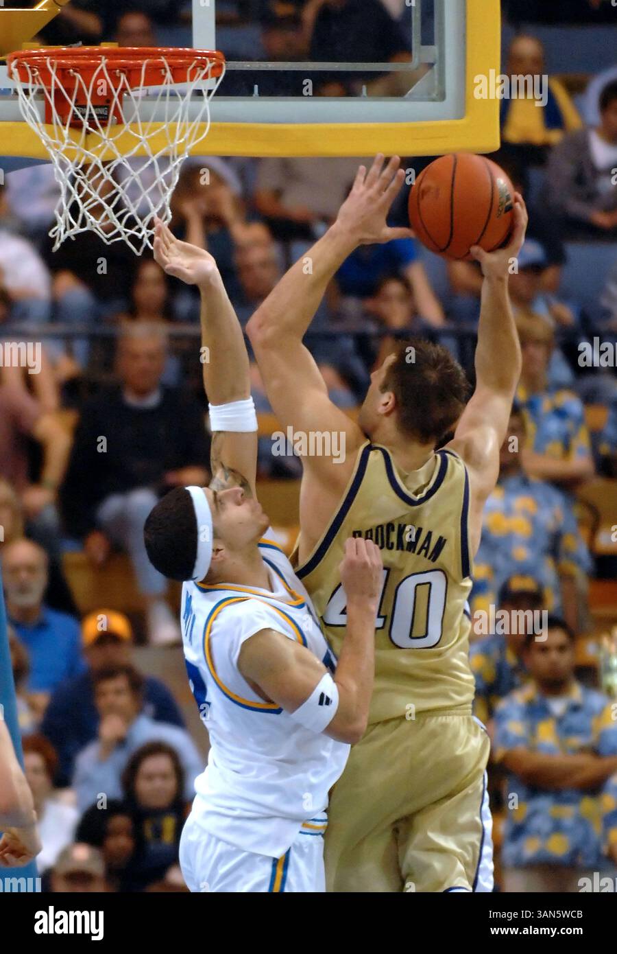 Jon Brockman #40 of the University of Washington goes to the hoop over ...