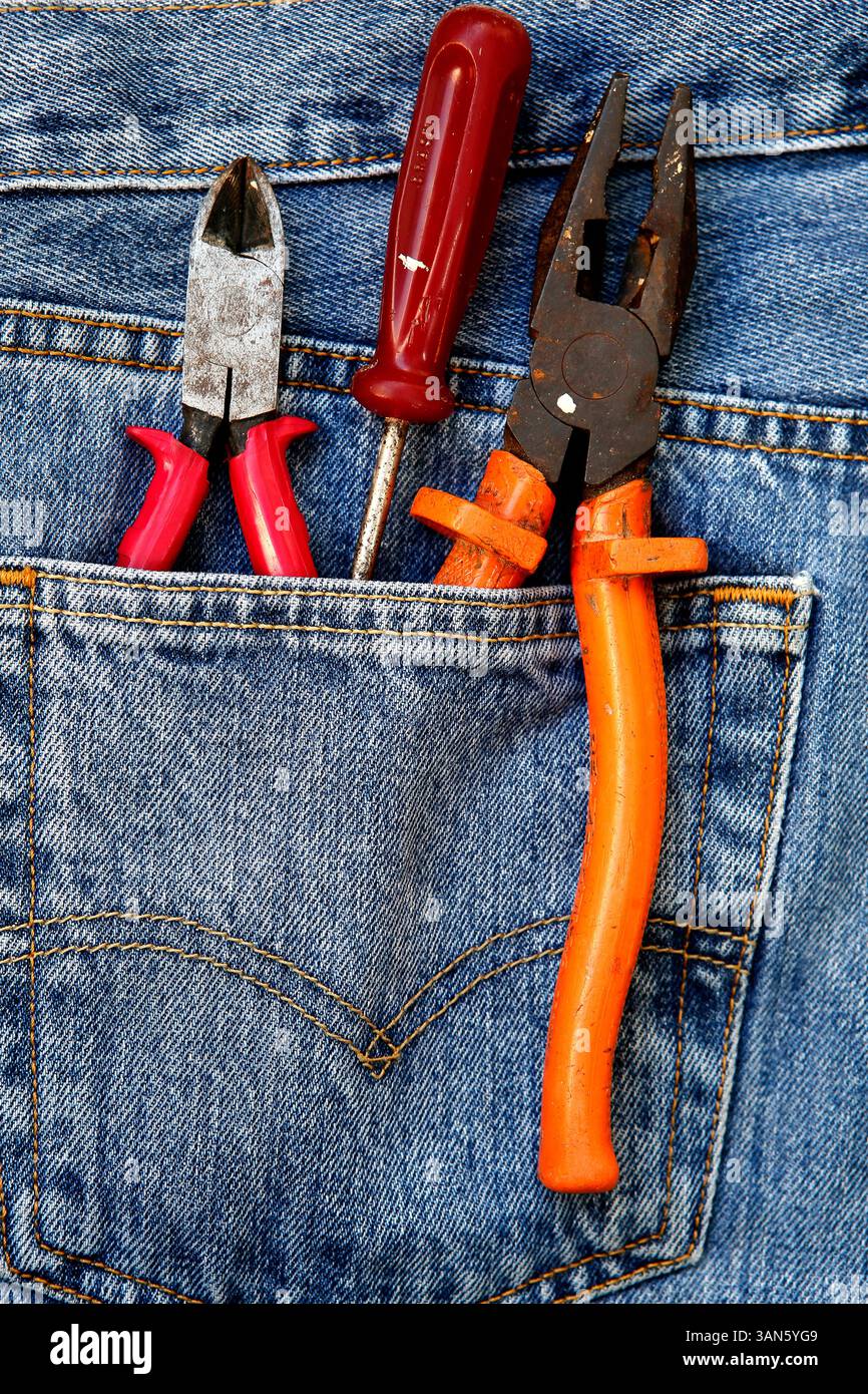dirty tools in jeans pocket Stock Photo - Alamy
