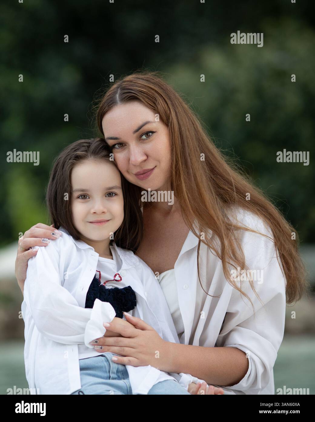 mother and daughter, a beautiful and tender moment between mother and daughhter Stock Photo - Alamy