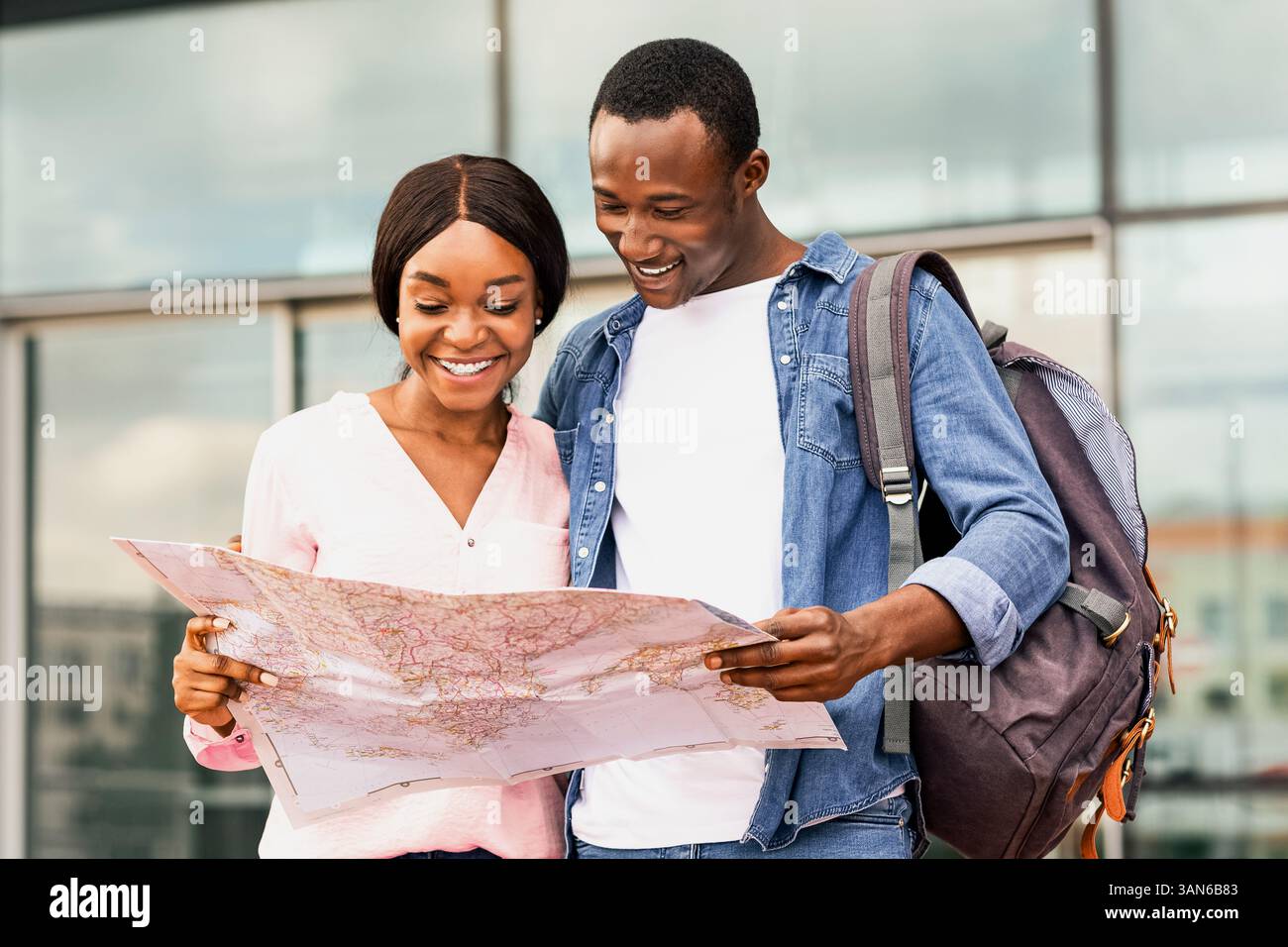 Two Happy Black Tourists Standing Near Airport, Checking City Map Stock ...