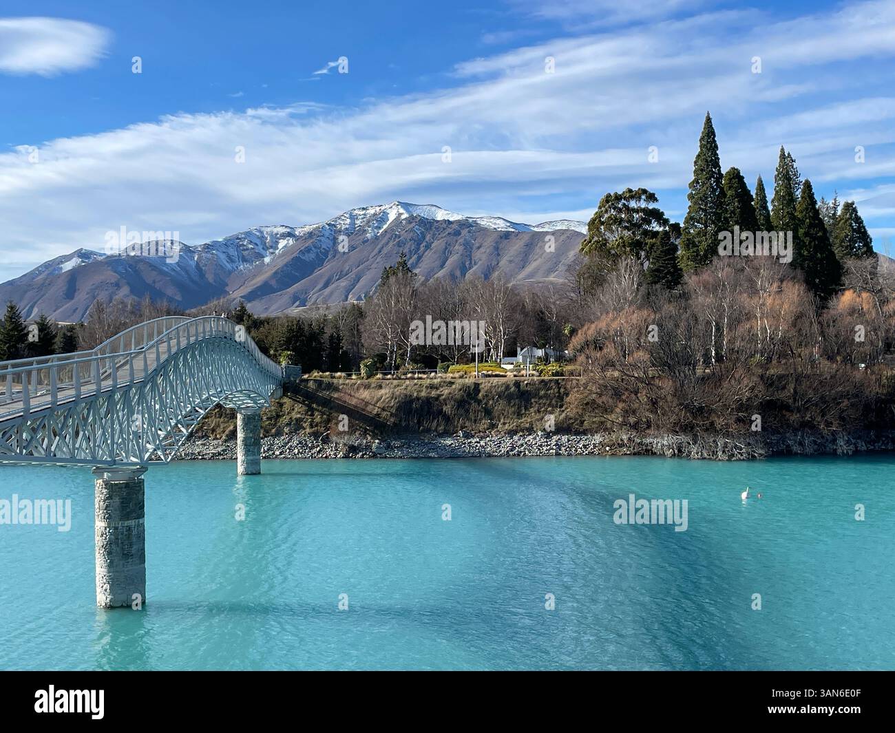 Pedestrian bridge across a river in the South Island of New Zealand ...
