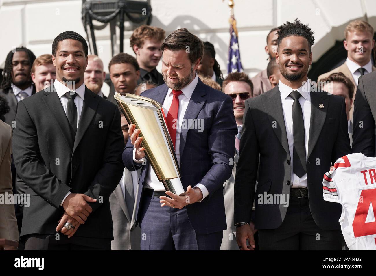 Vice President JD Vance holds the top of the team trophy after he ...