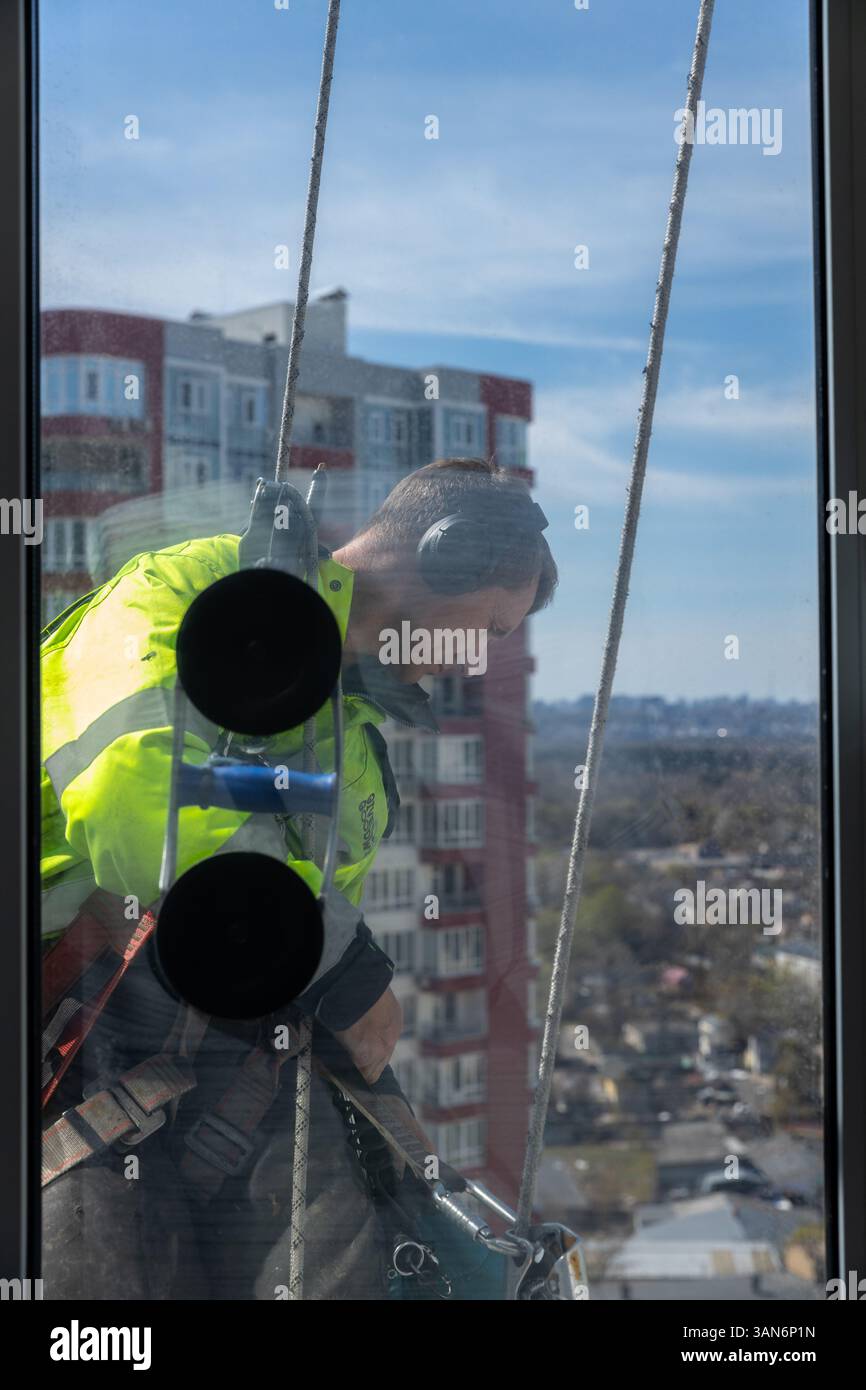 A Dedicated Window Cleaner at Work, Ensuring Crystal-Clear Views from ...